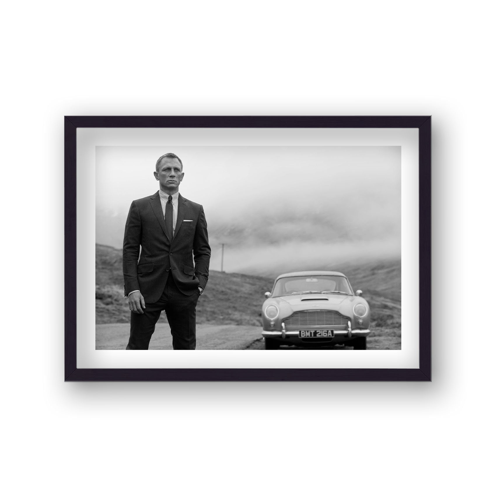 Daniel Craig as James Bond with Aston Martin DB5