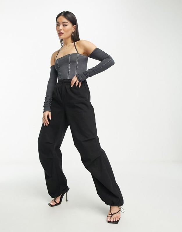 ASOS DESIGN bodysuit with seam details and halter strap in washed black