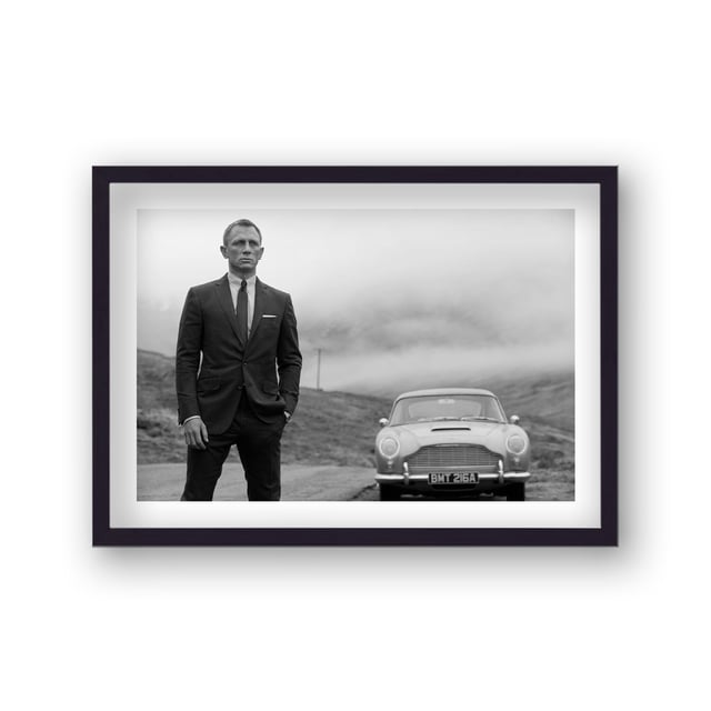 Daniel Craig as James Bond with Aston Martin DB5